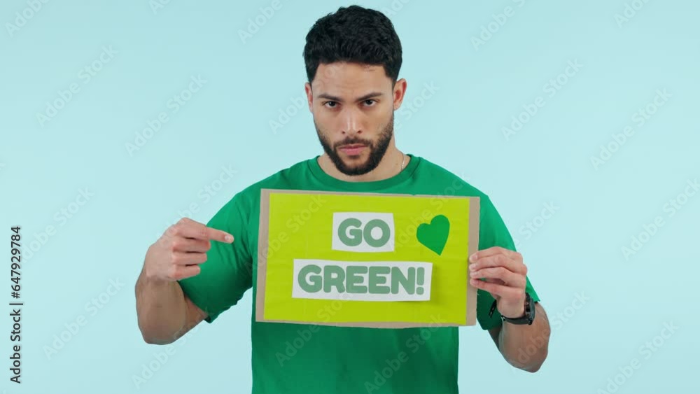 Activist, sign and green poster in studio while pointing for ...