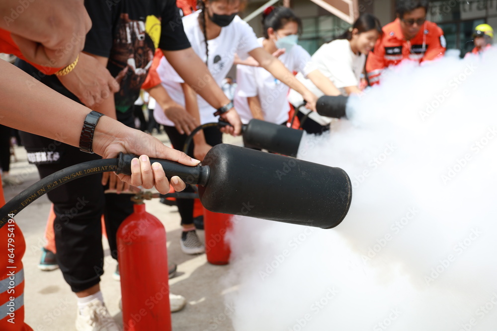 Employees firefighting training, Concept Employees hand using fire ...