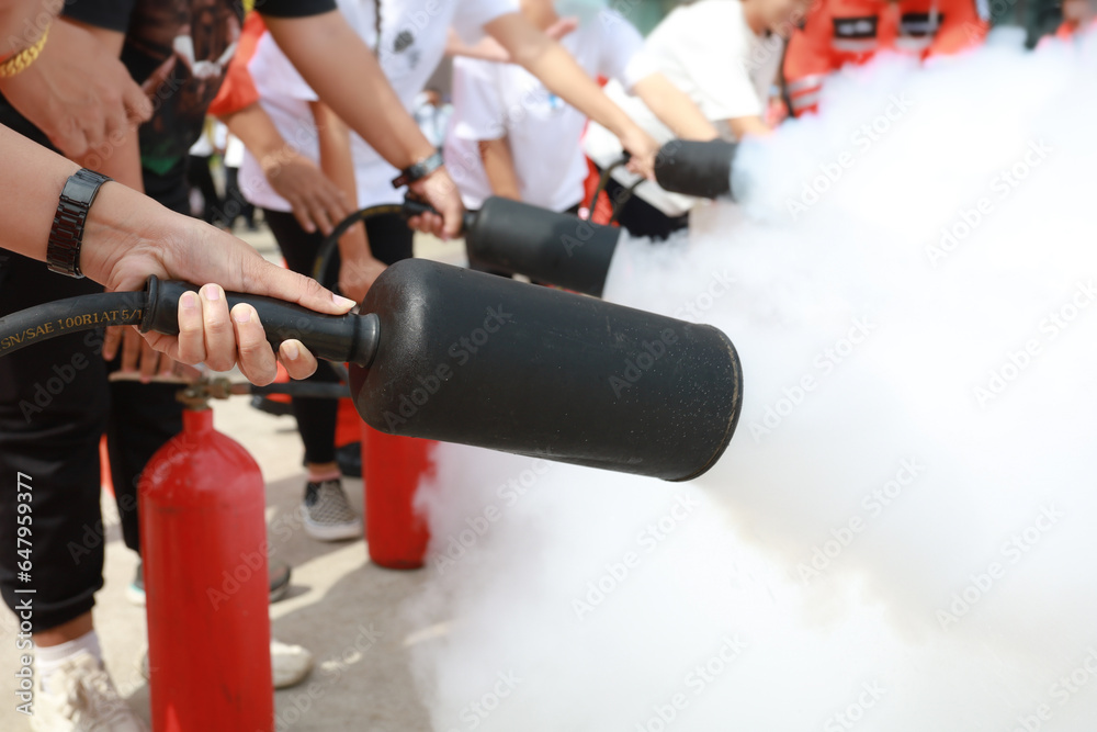 Employees firefighting training, Concept Employees hand using fire ...