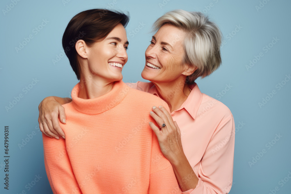 Two women are captured in heartwarming moment as they smile and embrace ...
