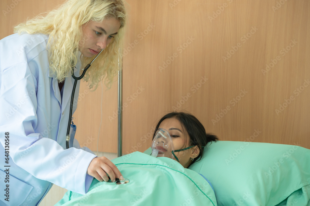 Woman doctors use stethoscope listening pulse examining patient check ...
