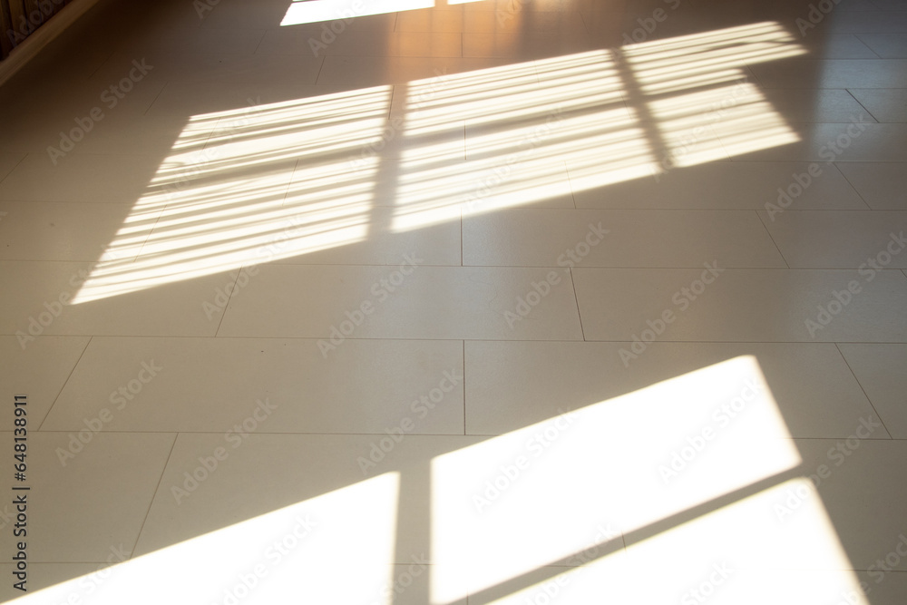 Shadow and light from a window on the floor of a house, sunlight and ...