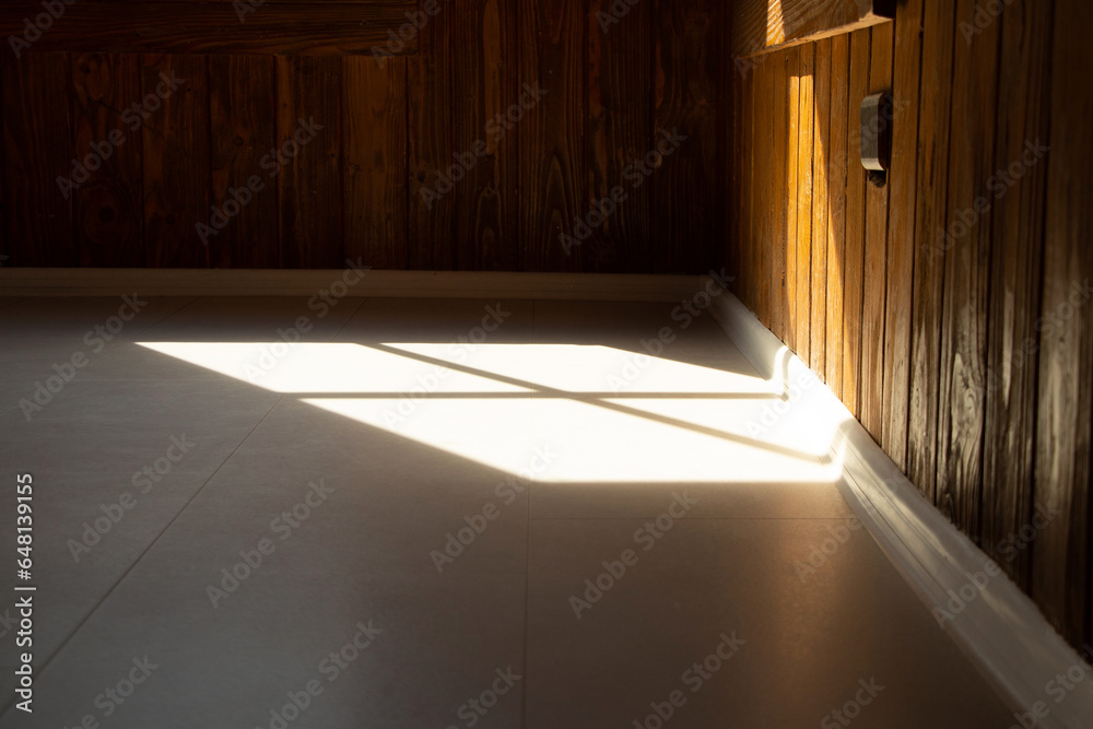 Shadow and light from a window on the floor of a house, sunlight and ...