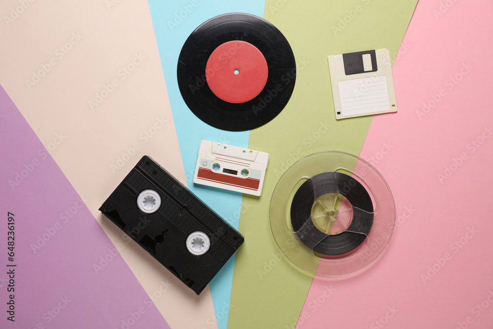 Floppy disk, vinyl record, film reel, vhs and audio cassette on a ...