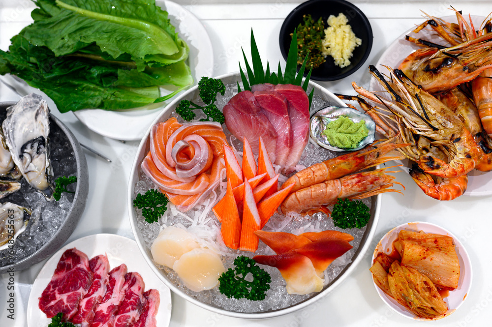 Top view Sashimi and sushi Japanese food buffet set. Salmon, wasabi ...