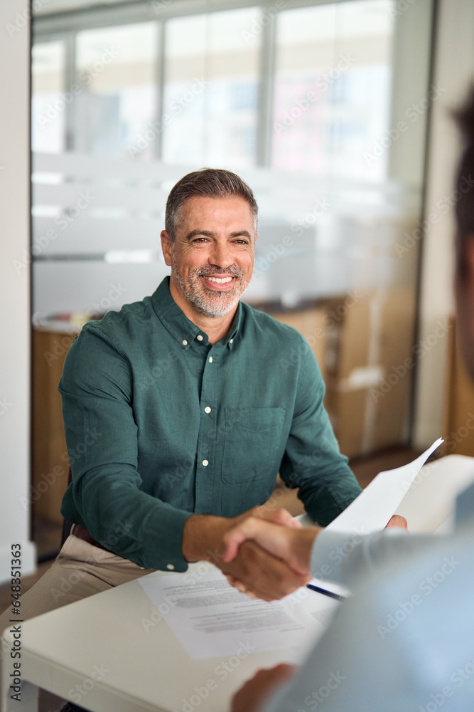 Recruiting handshake of hr manager and new worker at job interview ...