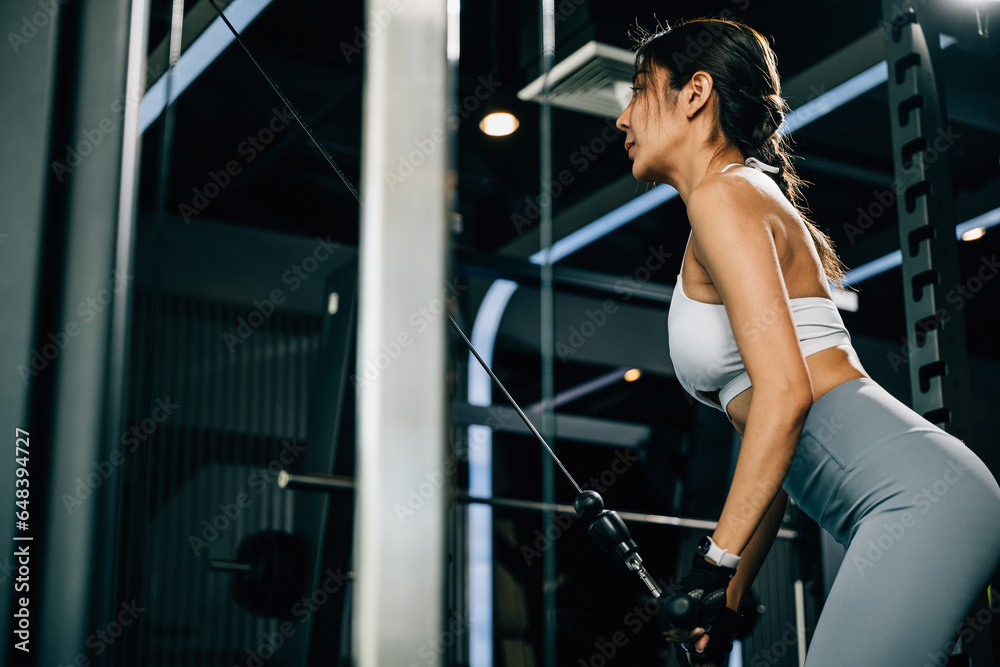 Healthy lifestyle and fitness concept - young woman pulling down ...