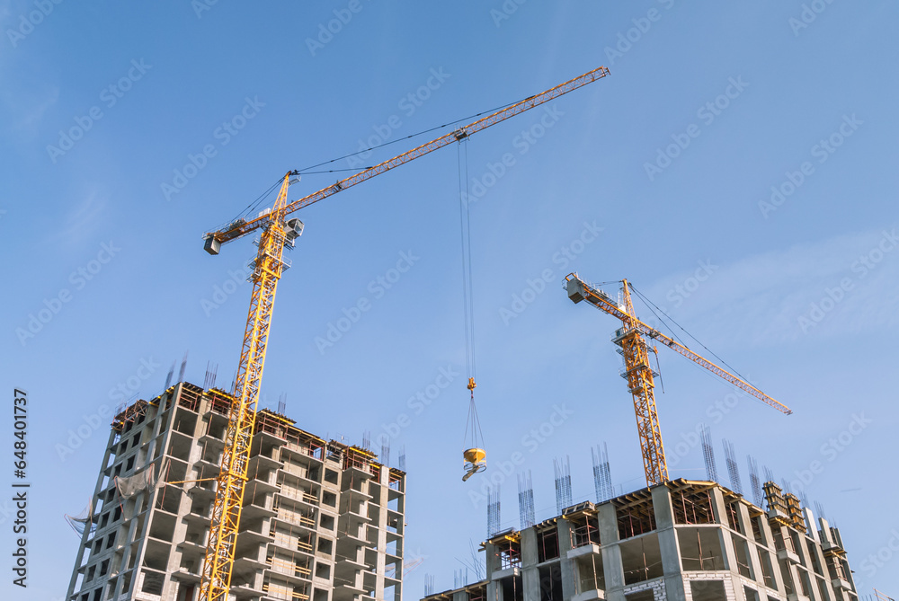 Buckets for concrete on the slings of a tower crane. Equipment for the ...