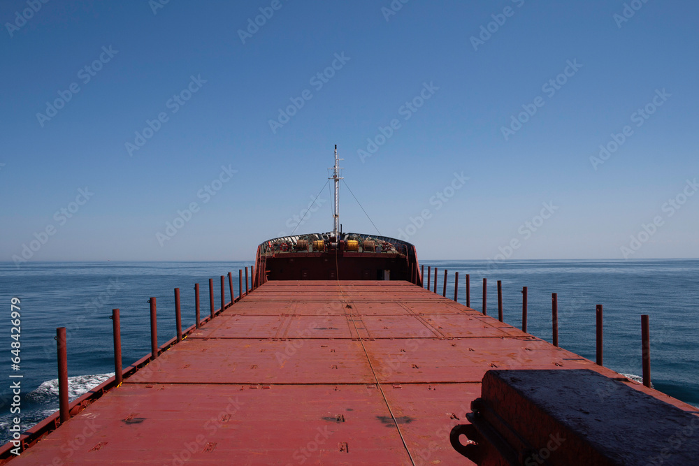 General, dry cargo ship with empty cargo deck at sea on its way to ...