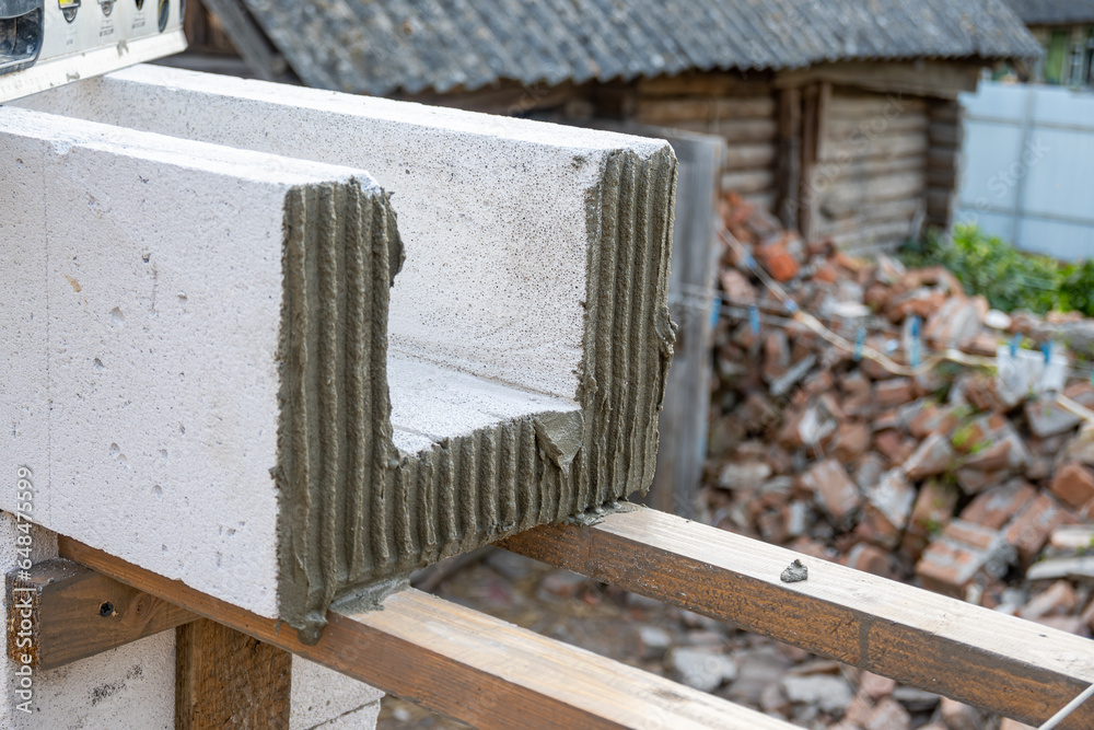 The process of laying aerated concrete block, brick. Construction of ...