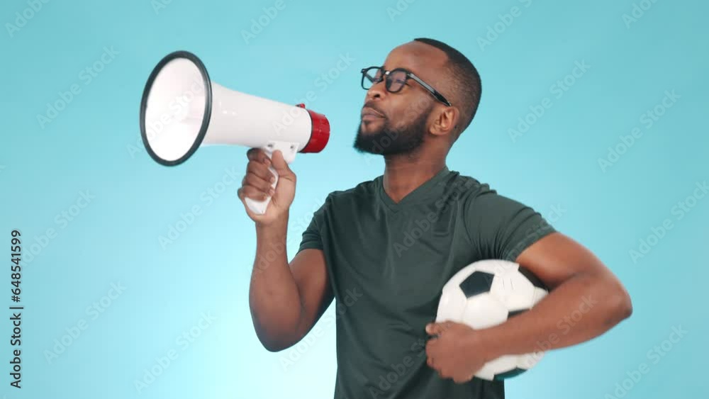 Football coach, man and megaphone in blue studio background, shouting ...