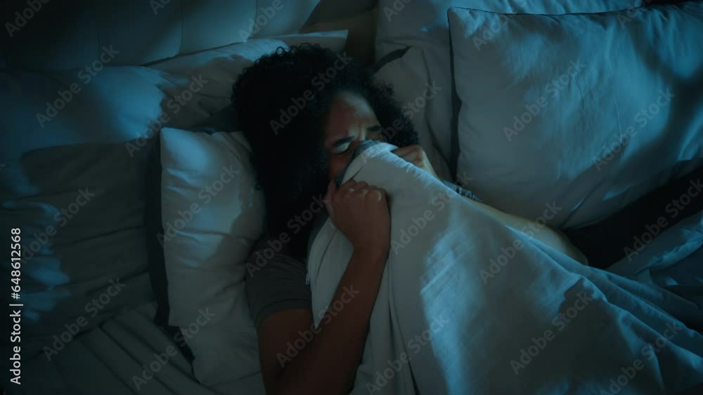 African american woman lying on bed night nightfall dark home bedroom ...