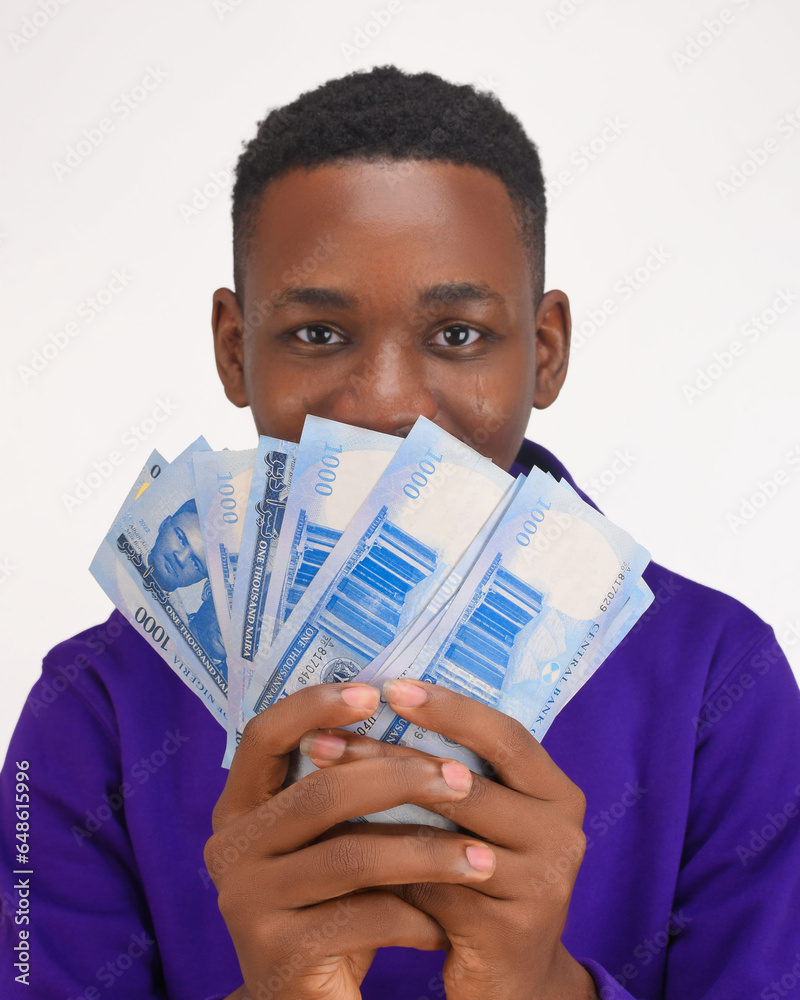 Handsome happy smiling African Nigerian man holding new naira notes ...