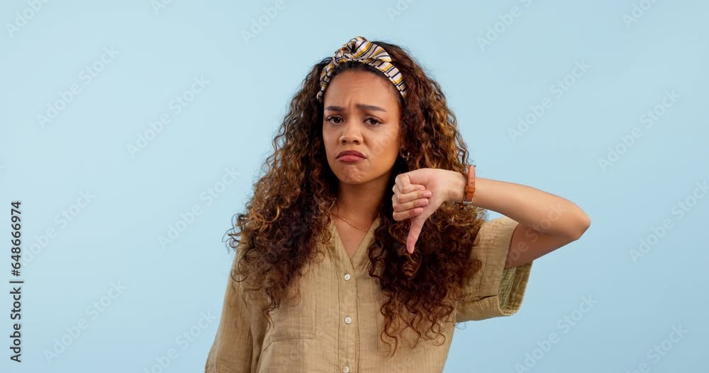 Sad, face and woman with thumbs down in studio for fail, mistake or ...