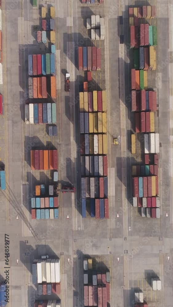 Vertical Video of Container yard, a bustling hub of stacked shipping ...