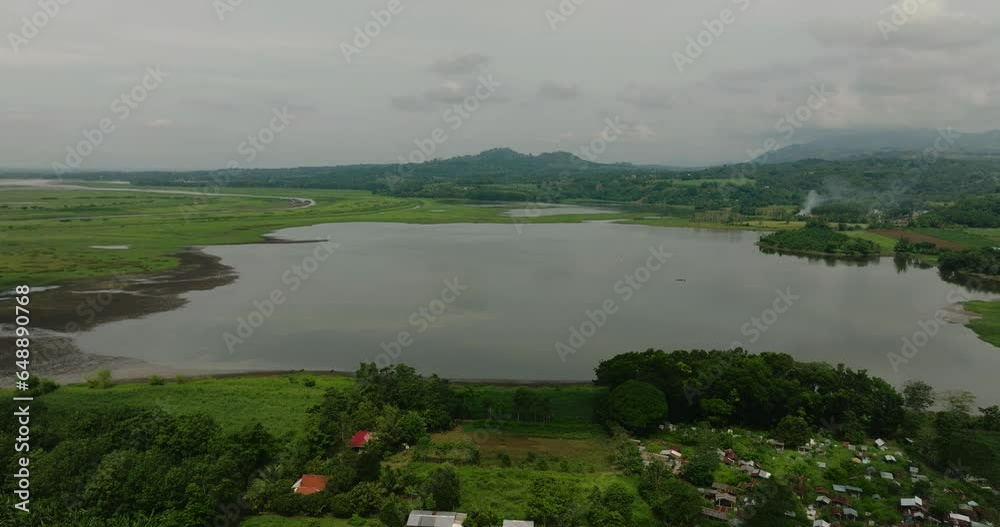 Tropical landscape with lake surrounded by greenery trees. Bukidnon ...