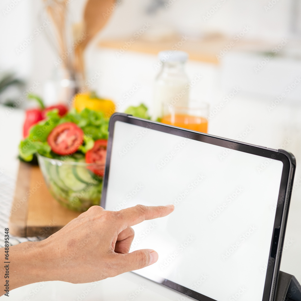 close up hand pointing tablet mockup white screen on vegetarian healthy ...