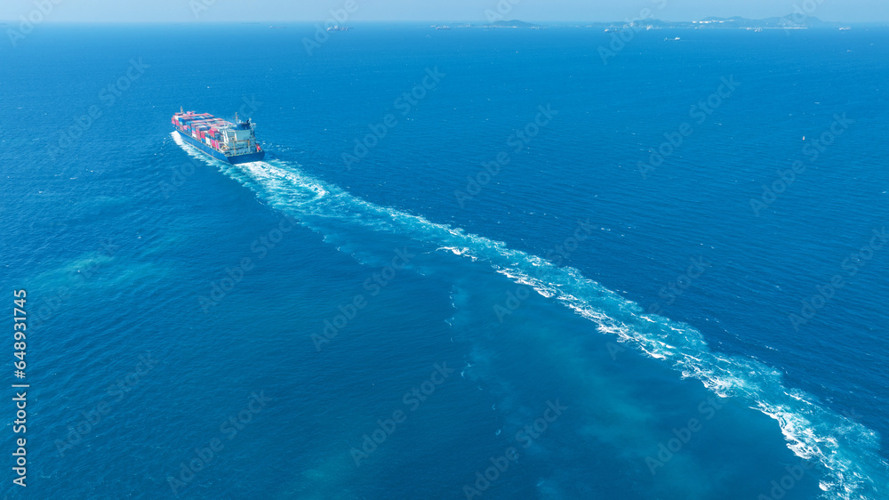 Stern of large cargo ship import export container box on the ocean sea ...