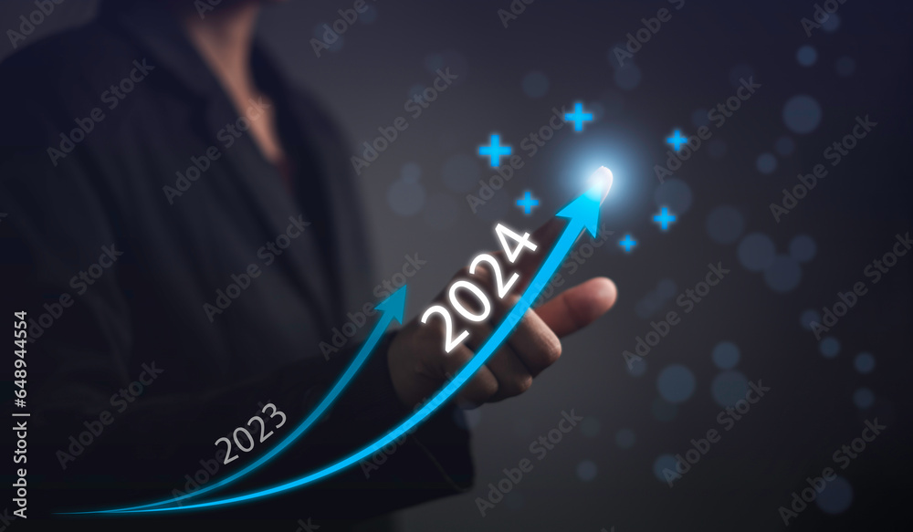 2023 change to 2024 business success concept. Businessman draws ...