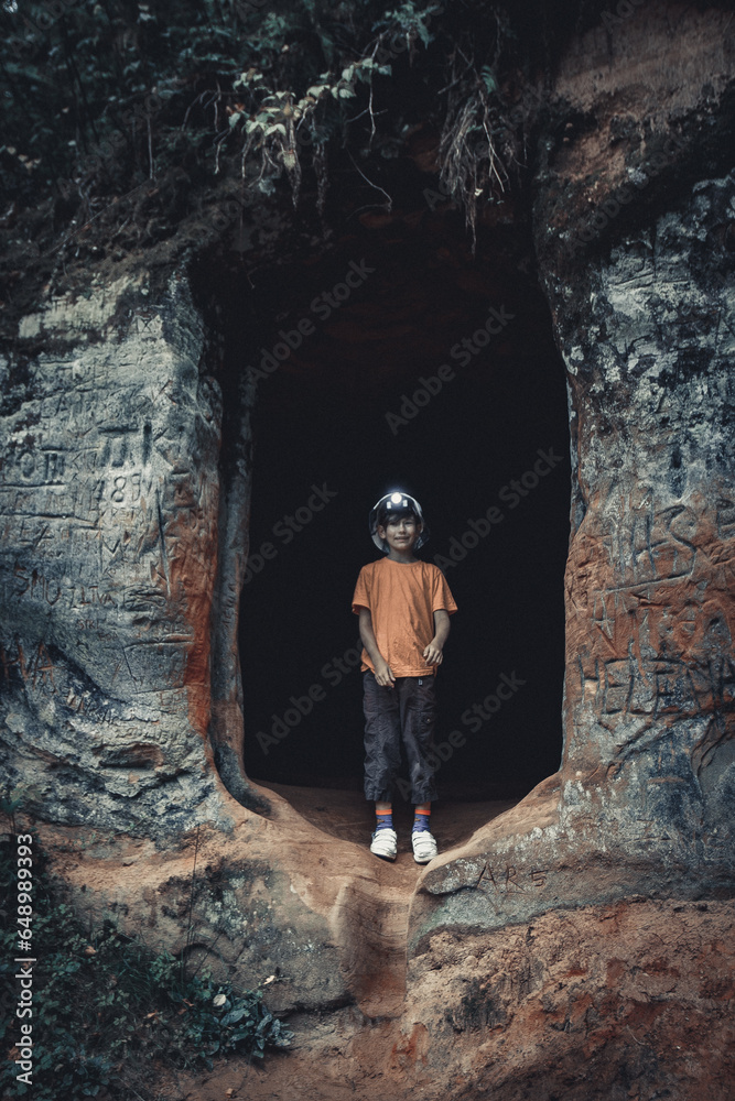 Happy face exploring cave architecture. Solo adventure connecting with ...
