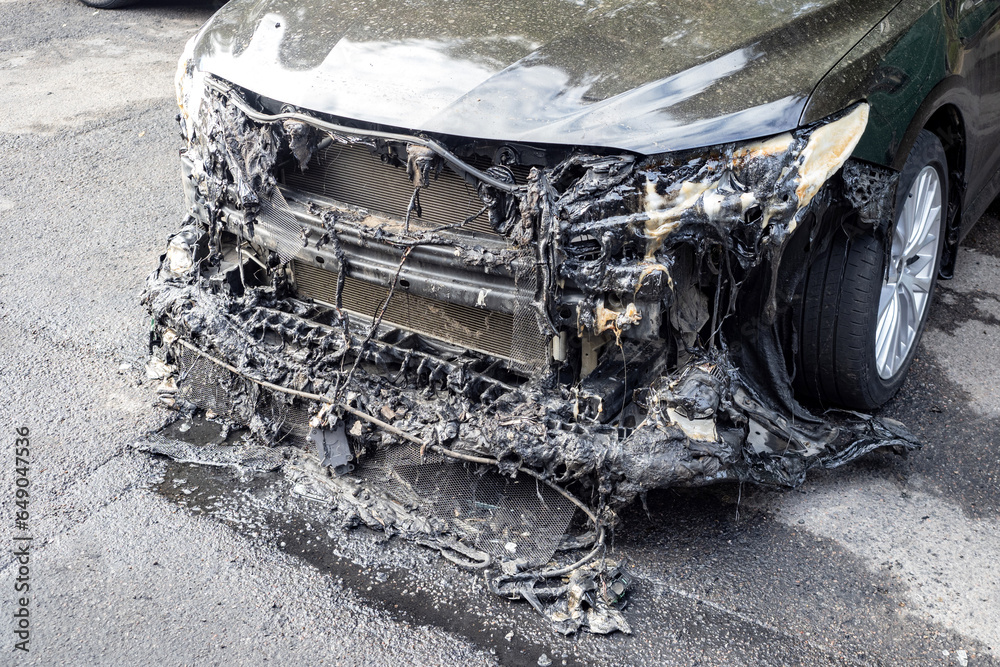 Car was damaged by fire. Automobile sedan with carbonized bumper and ...