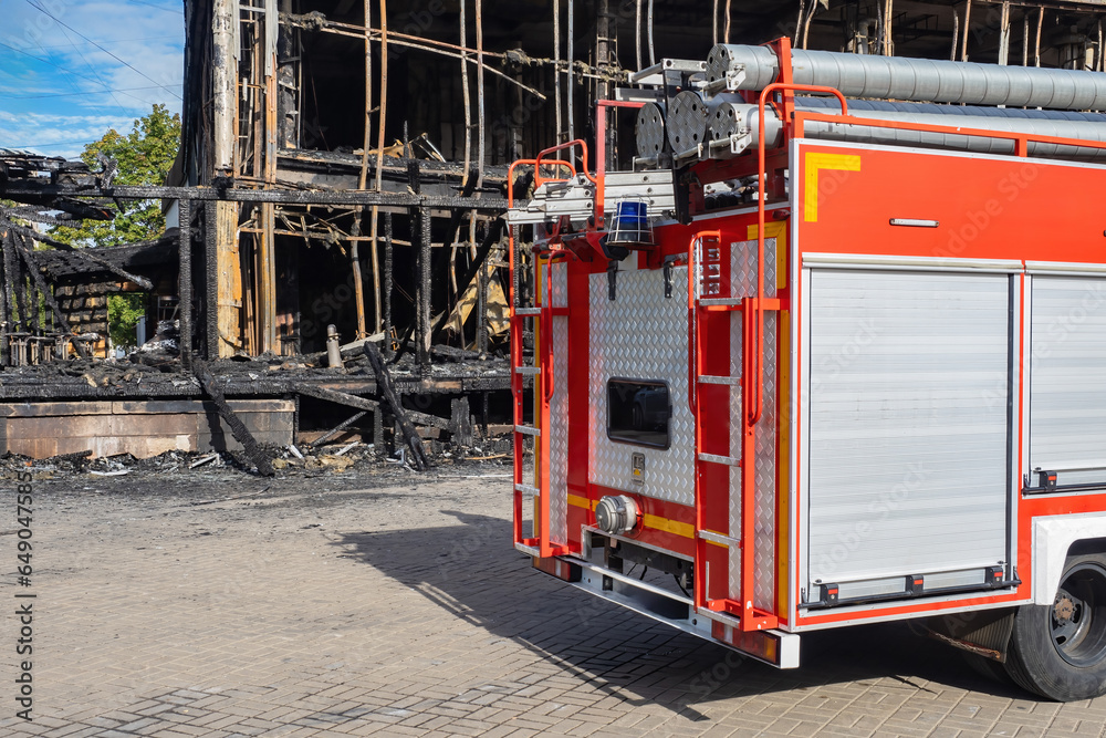 Emergency incident. Fragment of fire service vehicle. Ruins of burnt ...