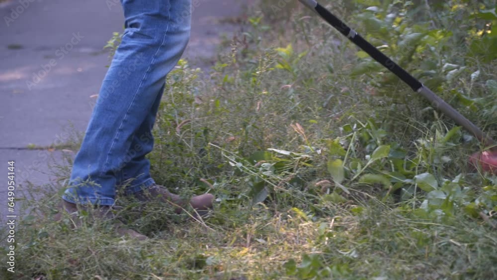 Municipal gardener landscaper Caucasian young man worker with gas grass ...