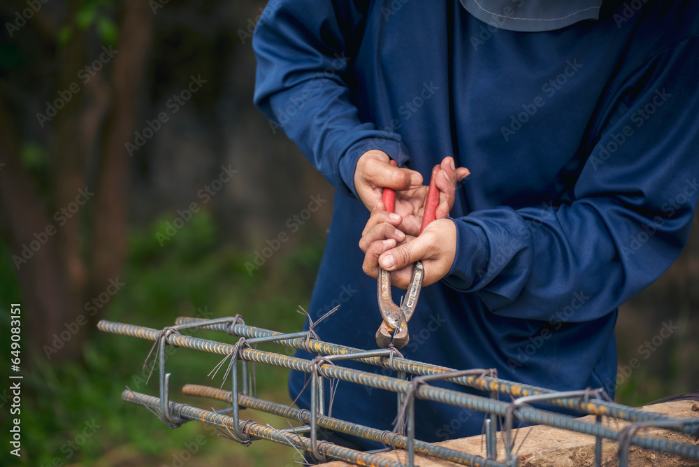 Construction Worker hands using pincer pliers iron wire. Outdoor Worker ...