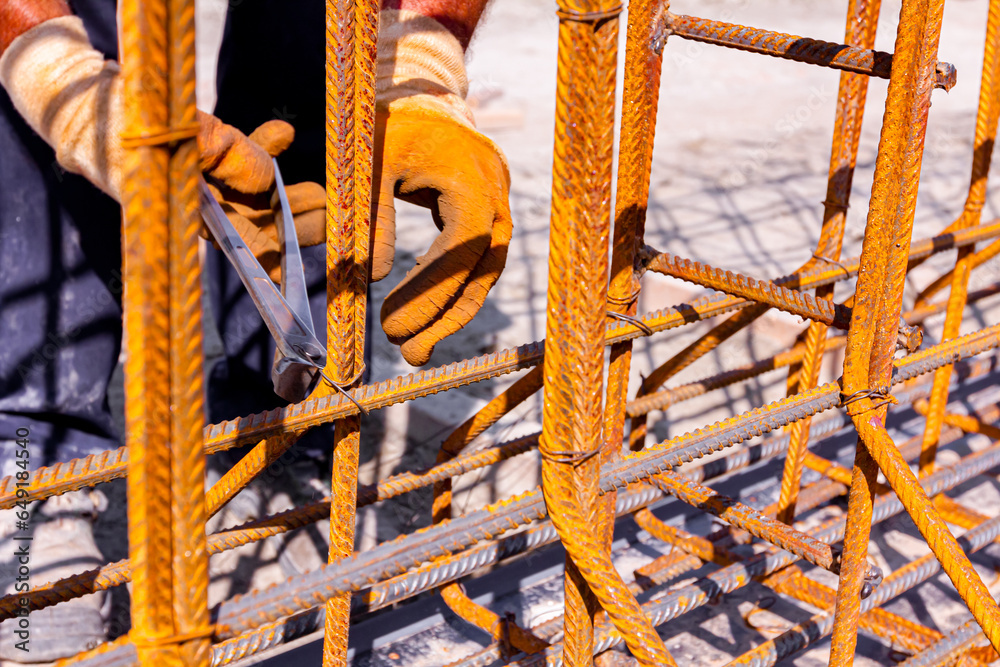 Construction worker binding rebar for reinforce concrete column at the ...