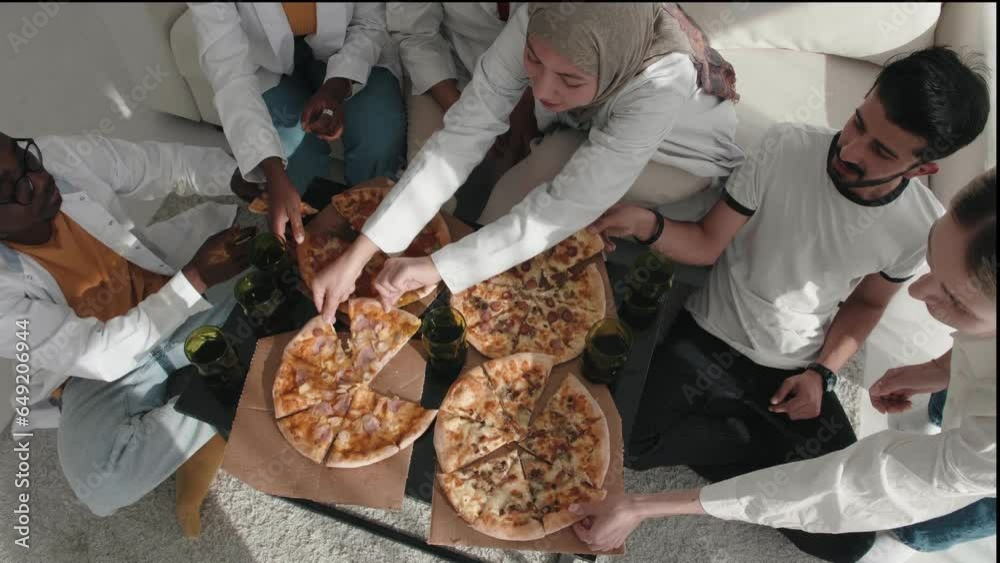 Multiracial group of colleagues doctors nurses having a break for lunch ...