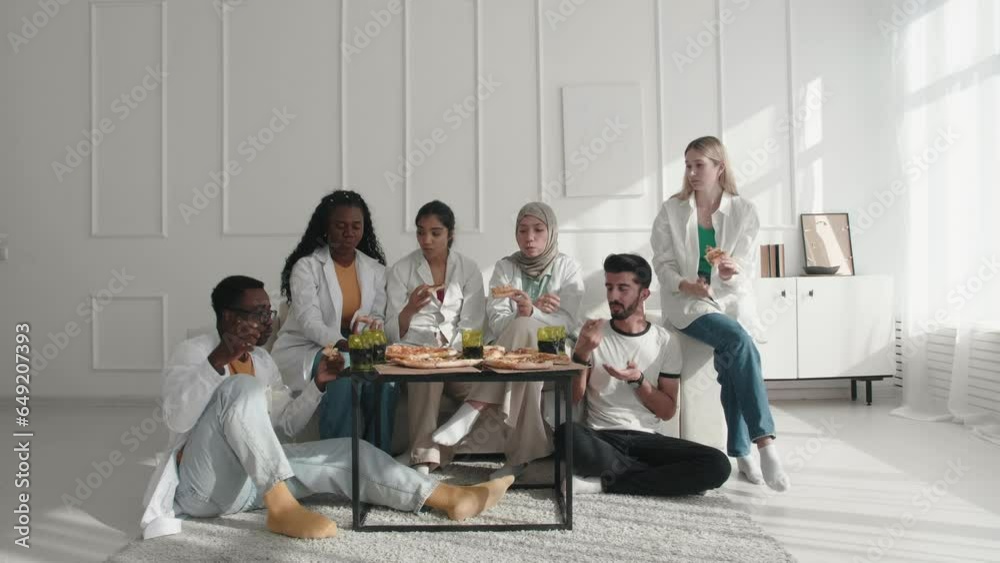 Medical team eating pizza together. Team building teambuilding at ...