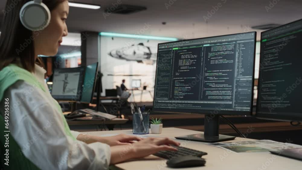 Female Asian Game Programmer Coding On Desktop Computer In Game ...