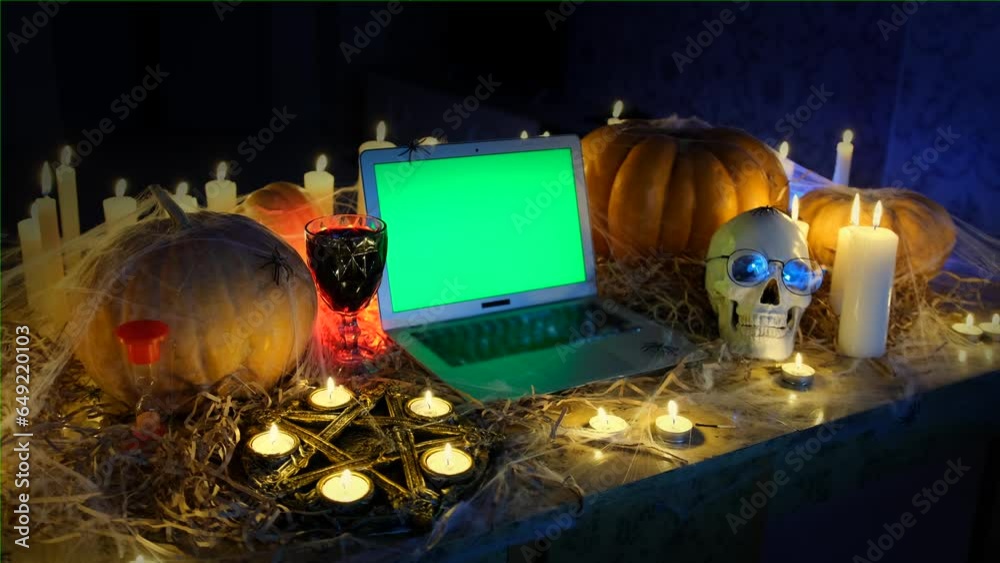 Altar Halloween party attributes, laptop with chromakey on screen ...