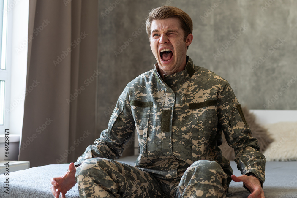 Stressed veteran soldier engrossed in depressive thoughts and memories ...