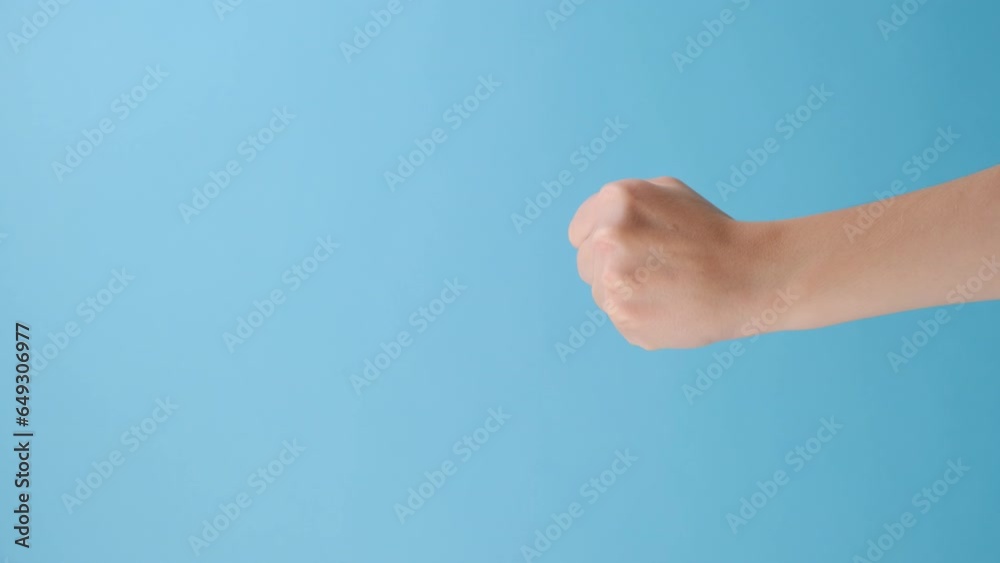 Vertical footage of angry unrecognizable woman shaking fist, isolated ...
