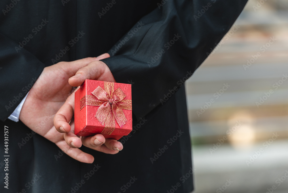 businessman carry red present in hands for romantic date at valentine ...