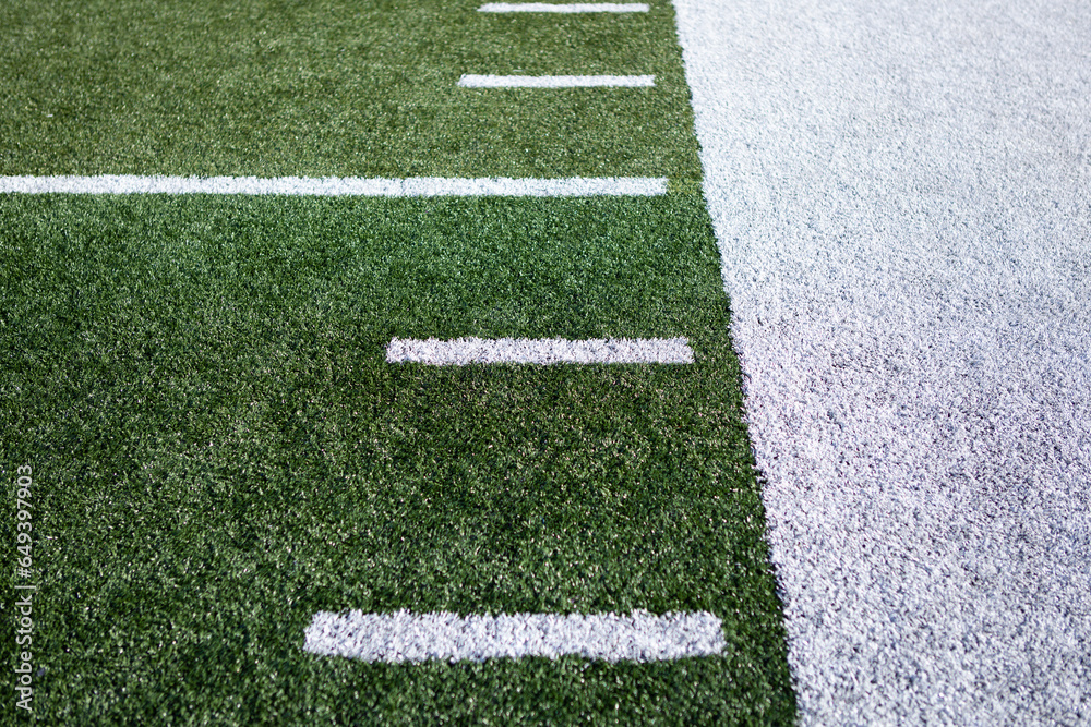 football field turf sideline. White dashes and out of bounds line Stock ...