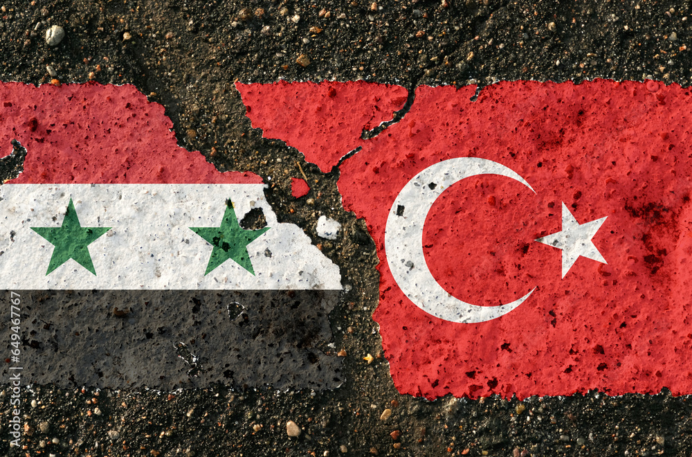 On the pavement are images of the flags of Syria and Turkey, as a ...