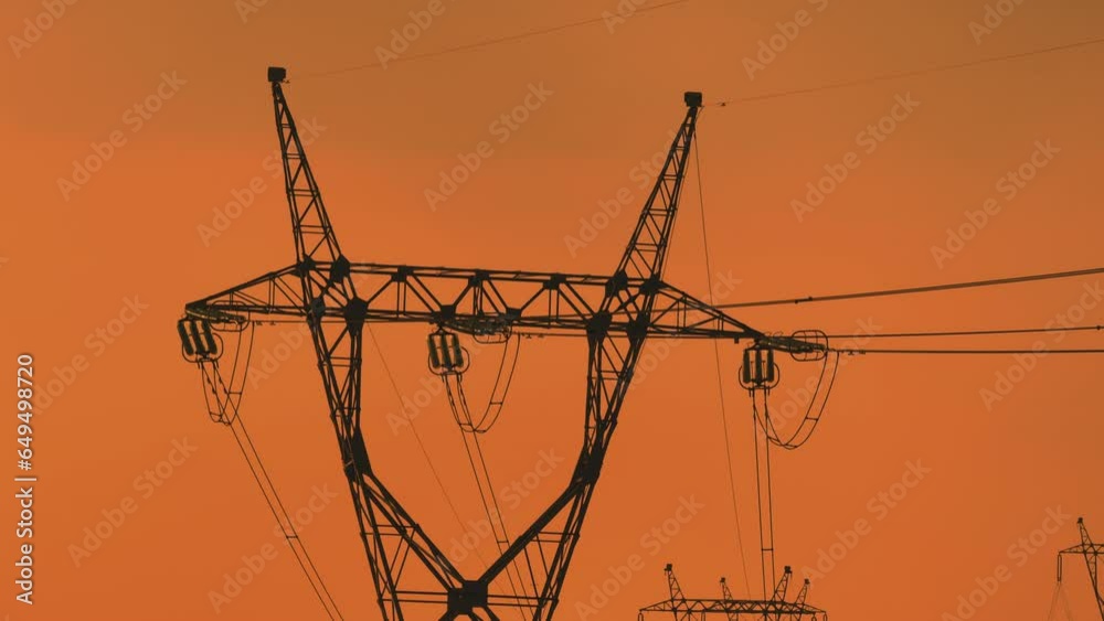 Transmission tower supporting an overhead high voltage power line. The ...