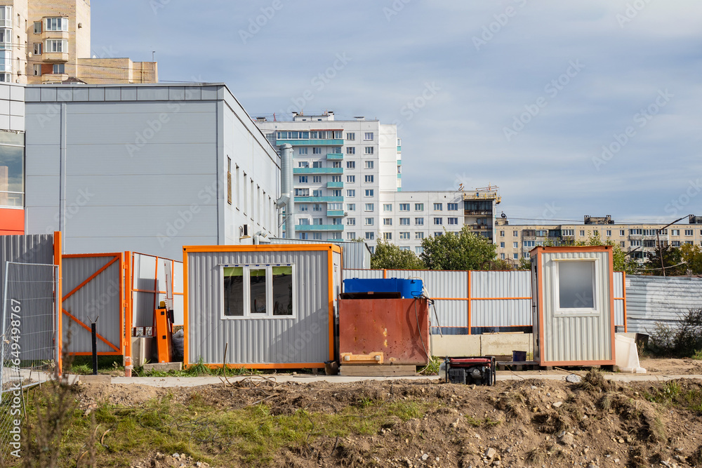 Change houses on construction site. Metal containers for staff of ...