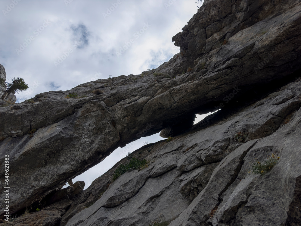 sharp structures in the rocks, holes and windows that see the sky Stock ...