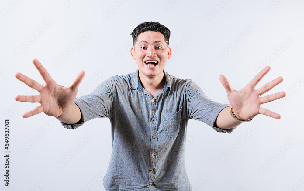 Happy young latin man welcoming with open arms isolated. Hospitable ...