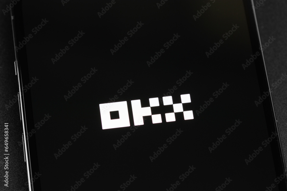OKX logo mobile app on a screen smartphone OKX is a global cryptocurrency and derivatives ...