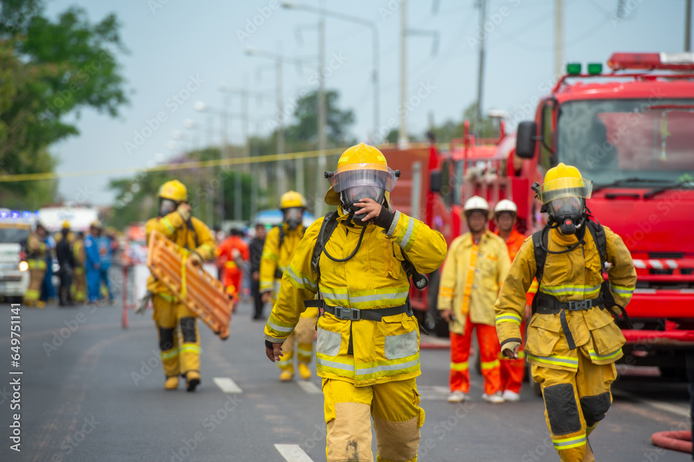 Rescue workers are bringing stretchers to move injured people from a ...