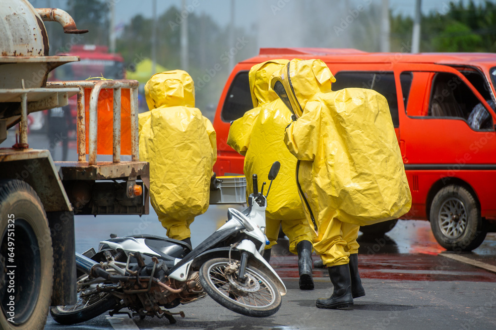 Rescue workers wear bio hazard suits. With an oxygen tank inside ...
