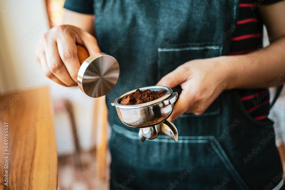 Hand Barista cafe making coffee with manual presses ground coffee using ...