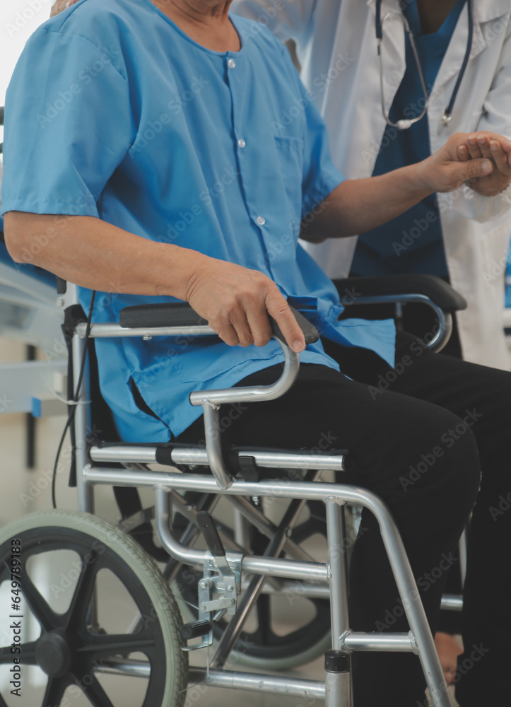Asian older aged man doing physiotherapist with support from nurse ...