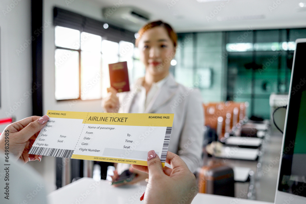 Hand of passenger service agent staff receiving boarding pass from ...