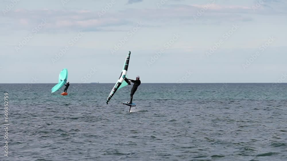 Modern water sport. Hydrofoil ride on the ocean using the wing and the ...