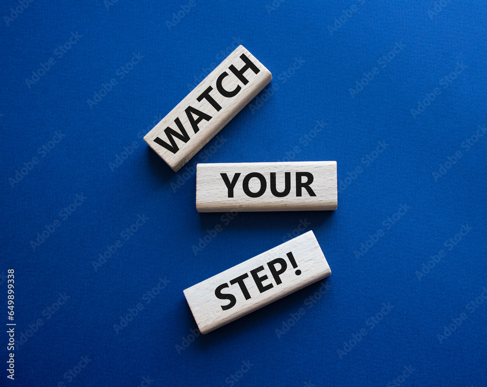 Watch your Step symbol. Concept words Watch your Step on wooden blocks ...